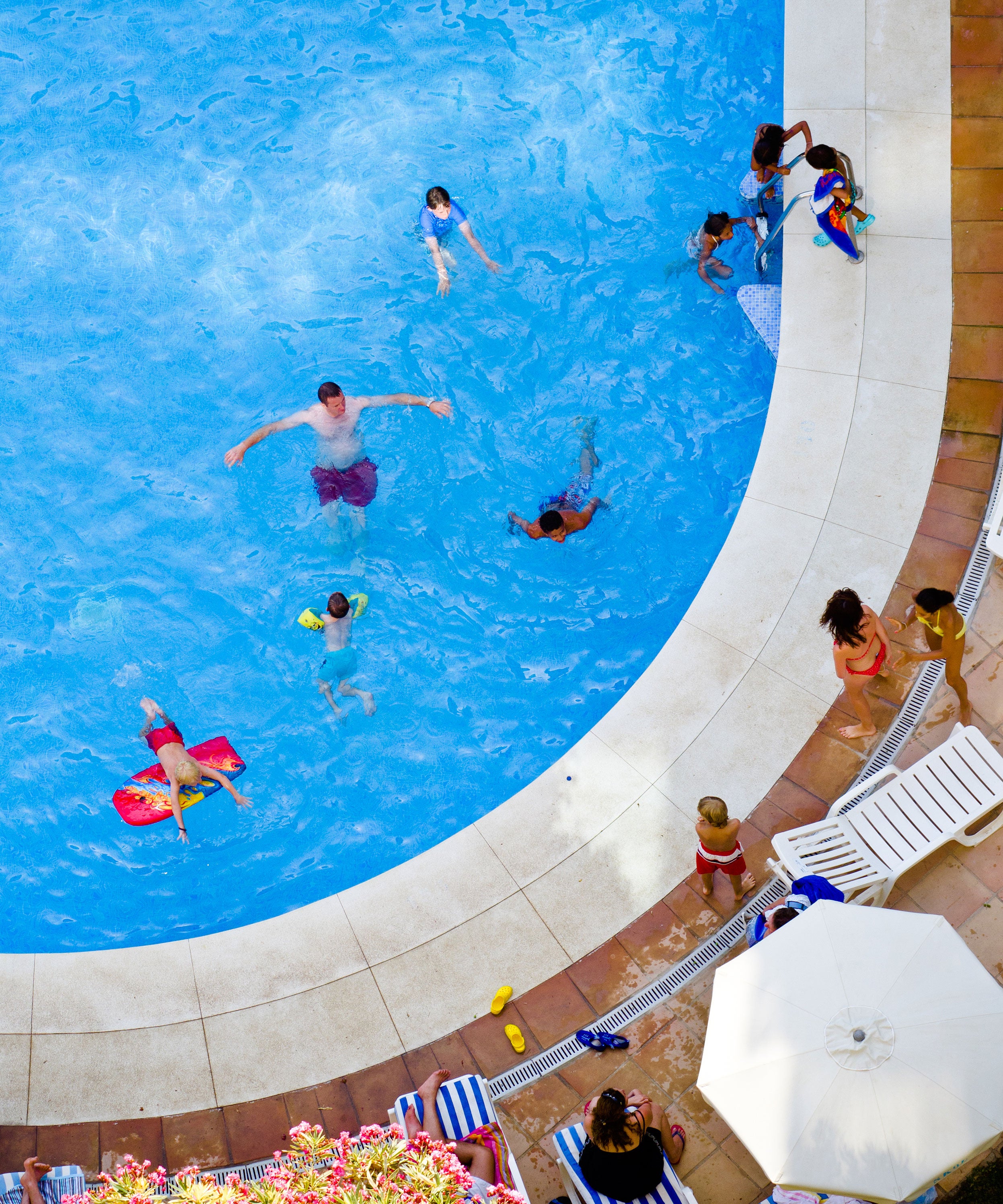 People Swimming In A Pool
